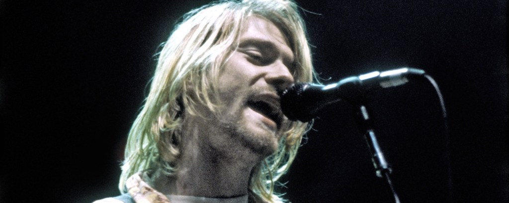 The Story and Meaning Behind Nirvana's Infamous Smiley Face Logo ...