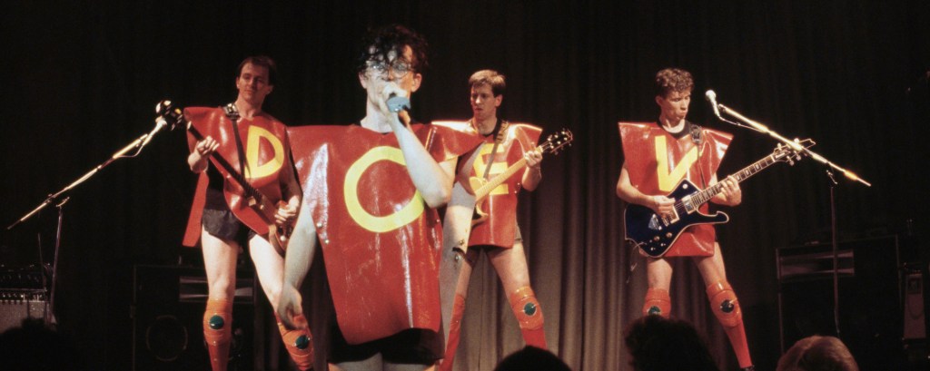 Behind the Band Name: Devo - American Songwriter