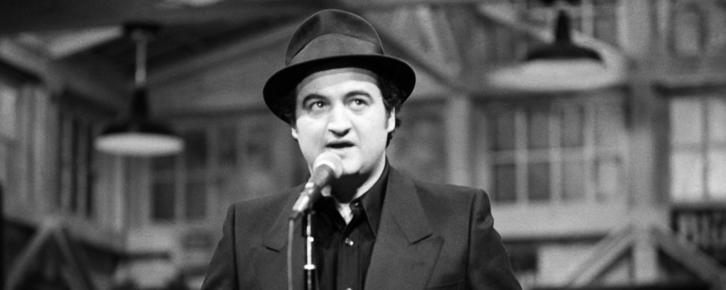 Remember When: John Belushi/Bluto Smashes a Guitar—and the Whole Folk ...